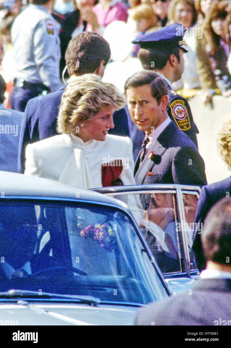 Princess Diana and Prince Charles are surrounded by security as they ...