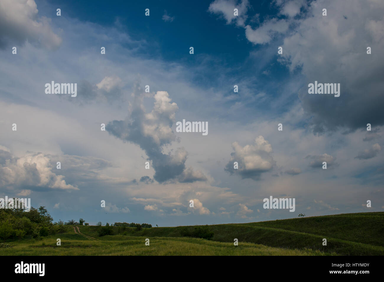 Rural landscape in hilly terrain with rain clouds. Ukraine. Europe ...