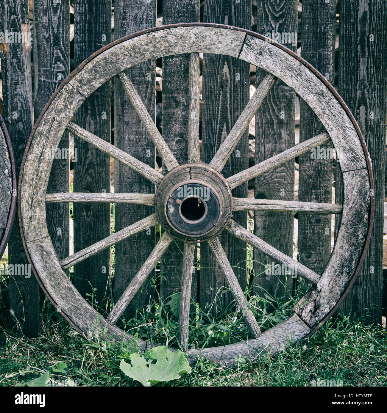 Old Wooden Cart Wheel in the village Stock Photo - Alamy