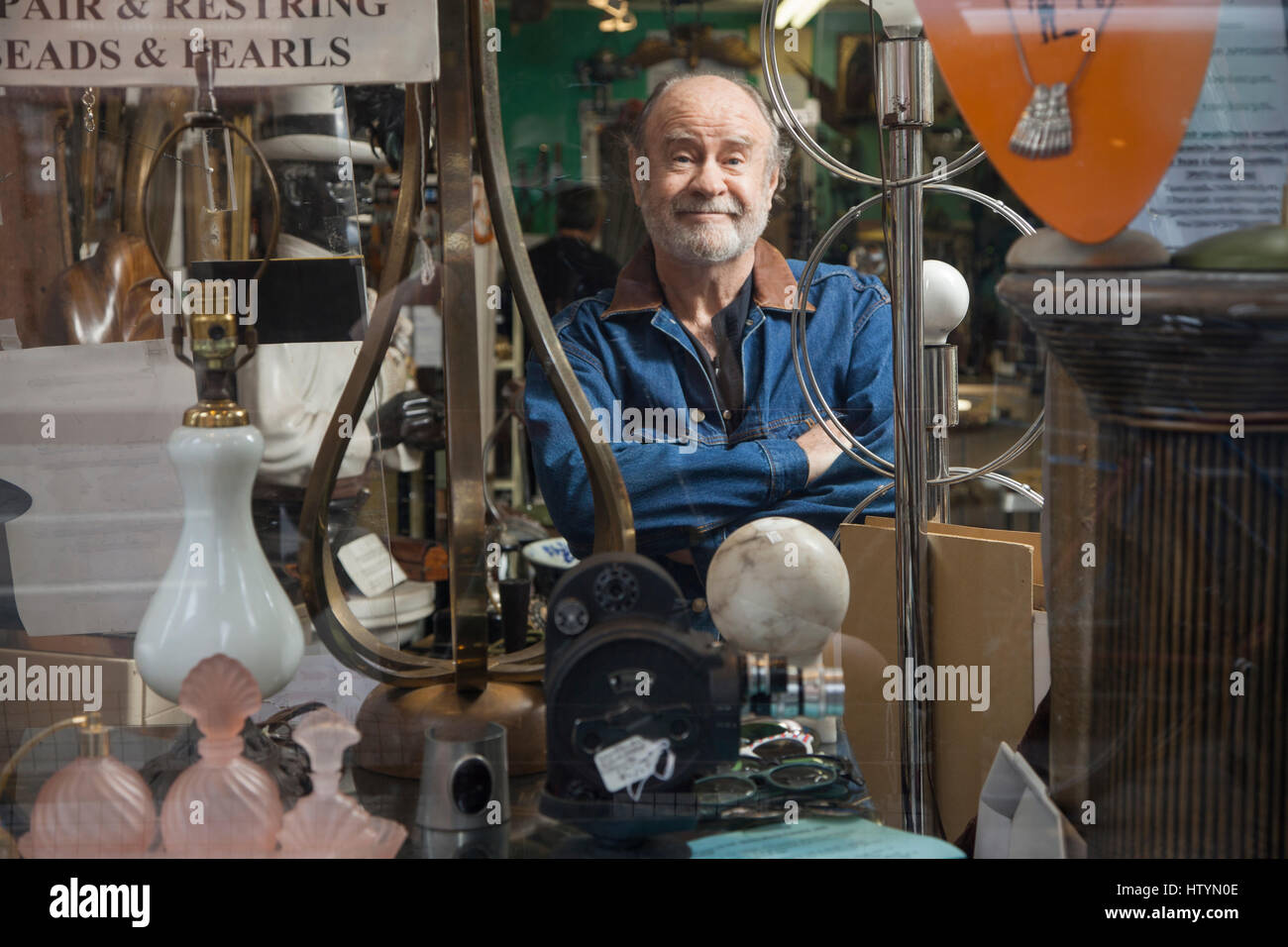 Antique store owner Stock Photo - Alamy