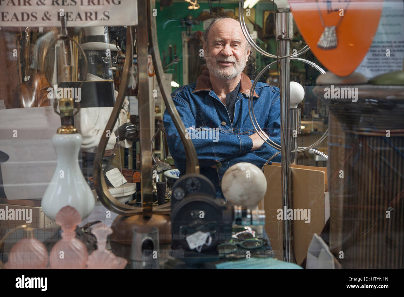 Antique store owner Stock Photo - Alamy