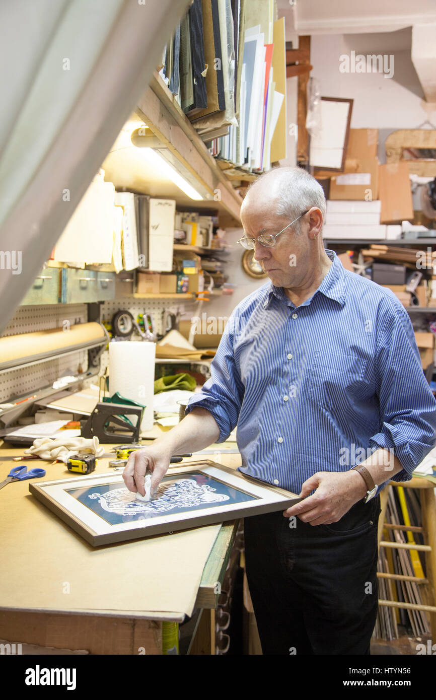 Frame shop owner Stock Photo - Alamy