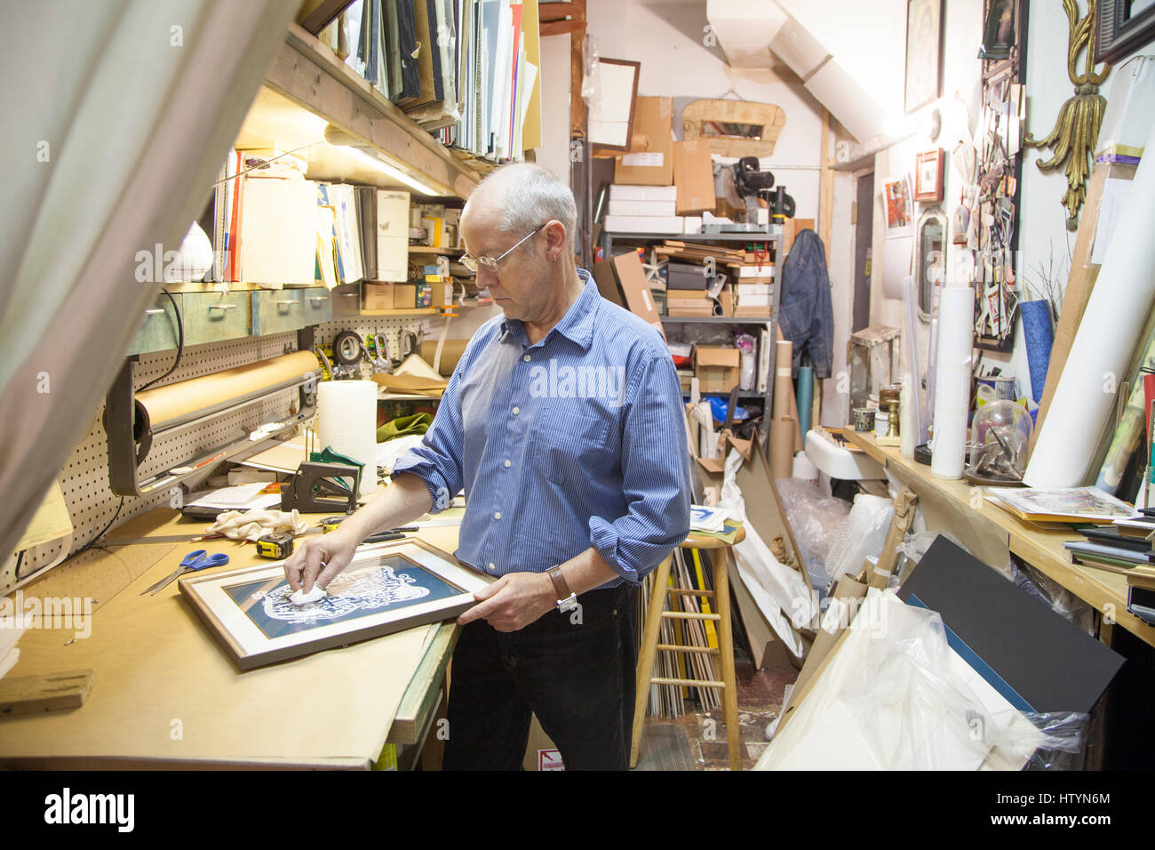 Frame shop owner Stock Photo - Alamy