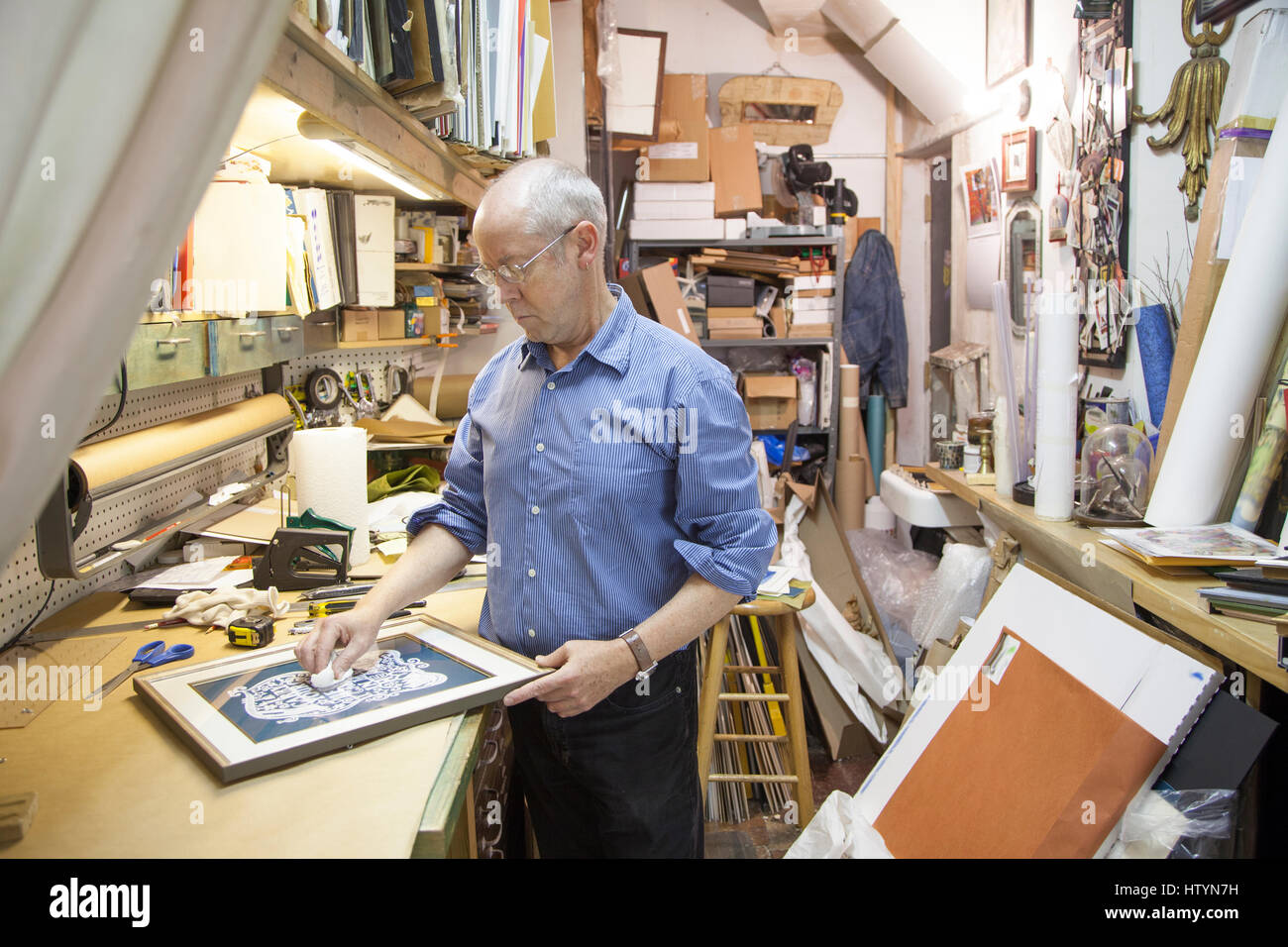 Frame shop owner Stock Photo - Alamy