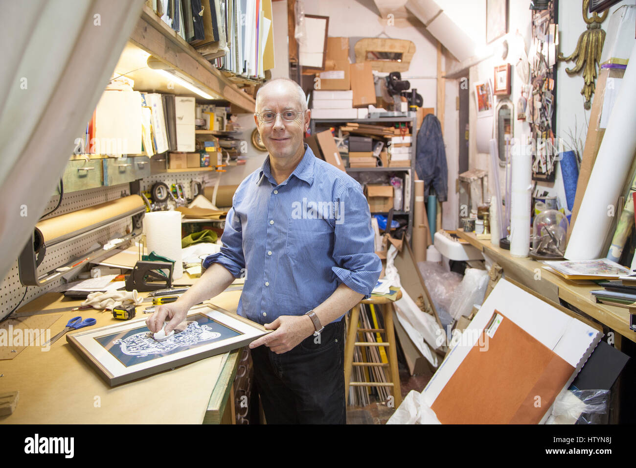 Frame shop owner Stock Photo - Alamy