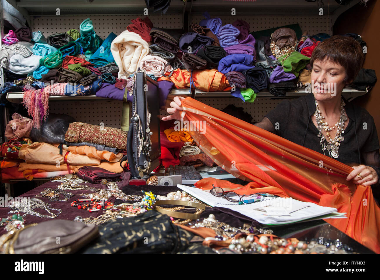 Fashion designer in studio Stock Photo - Alamy