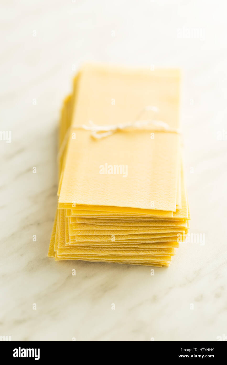 Raw lasagne sheets on kitchen table Stock Photo - Alamy