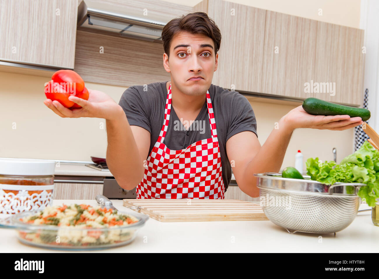 Man male cook preparing food in kitchen Stock Photo - Alamy