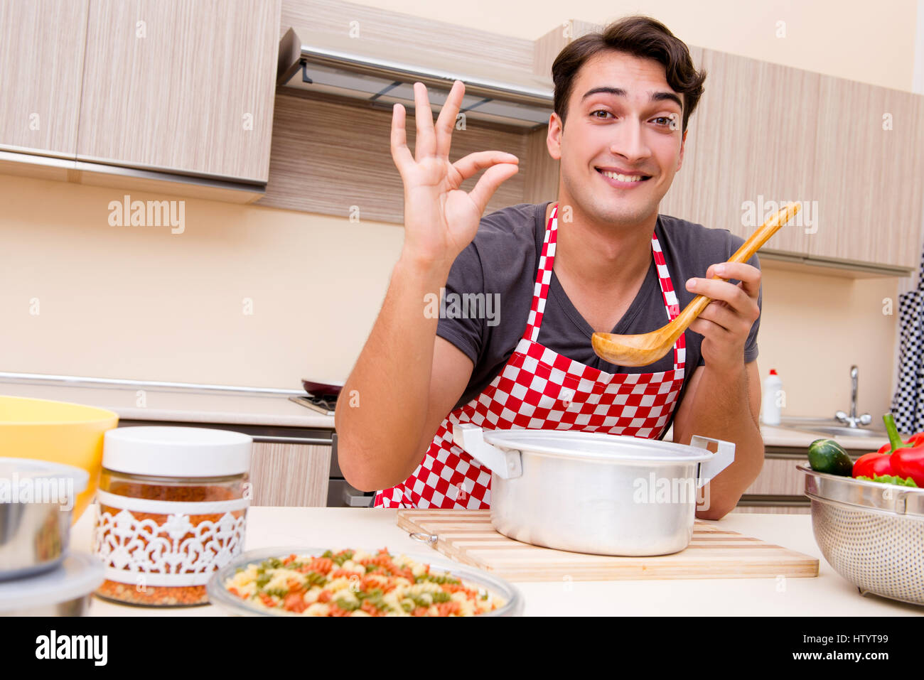 Man male cook preparing food in kitchen Stock Photo - Alamy