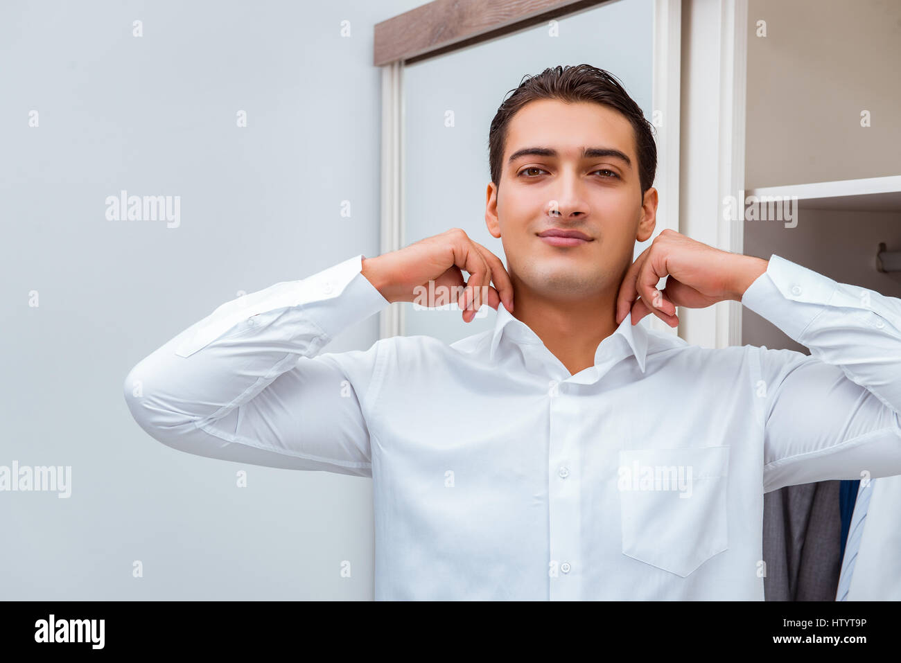 Businessman dressing up for work Stock Photo - Alamy
