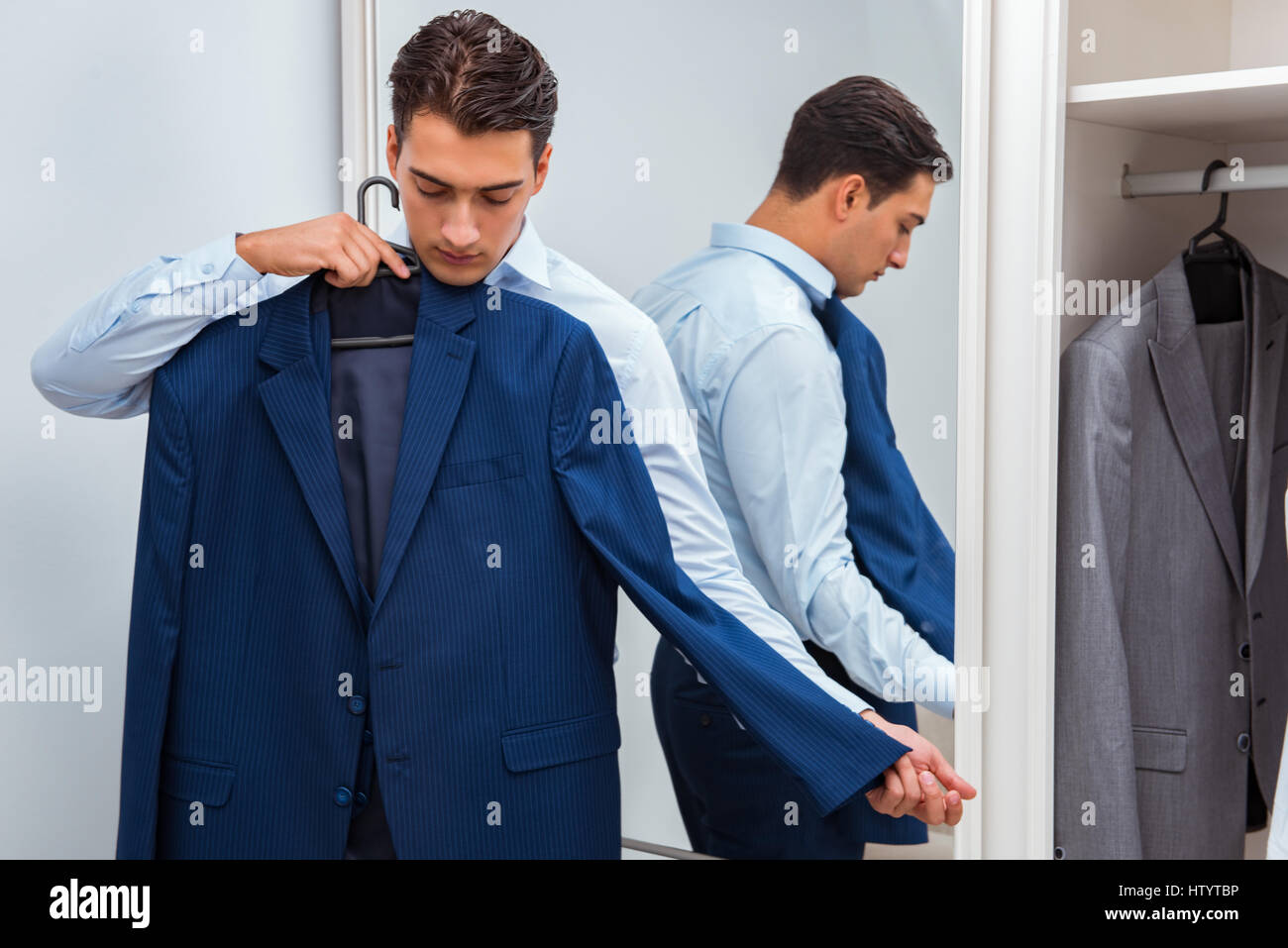 Businessman dressing up for work Stock Photo - Alamy