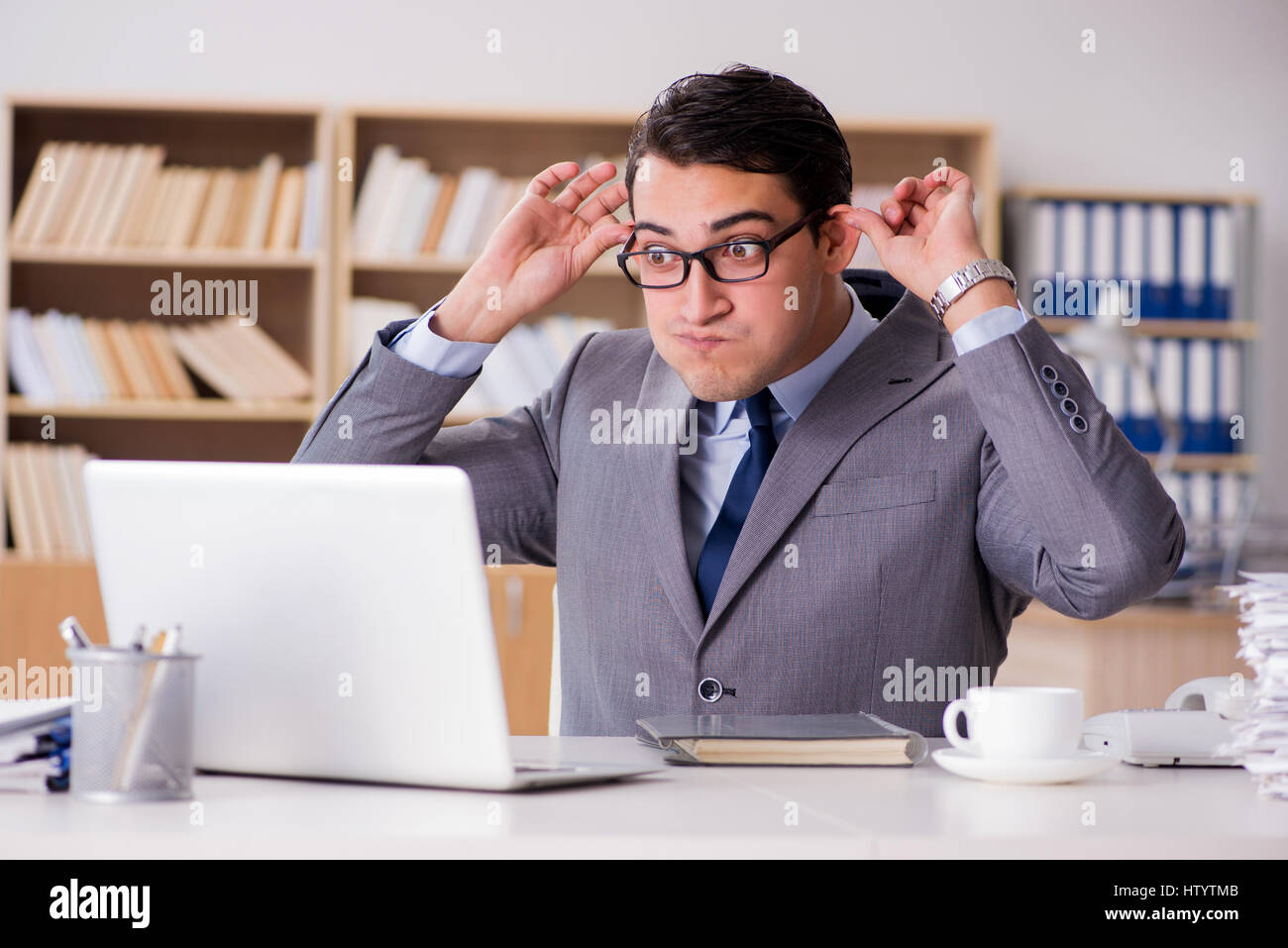 Angry businessman working in the office Stock Photo - Alamy