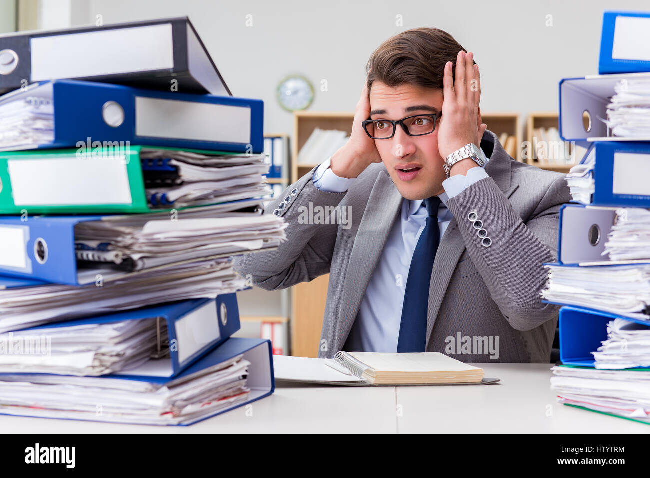 Busy businessman under stress due to excessive work Stock Photo - Alamy