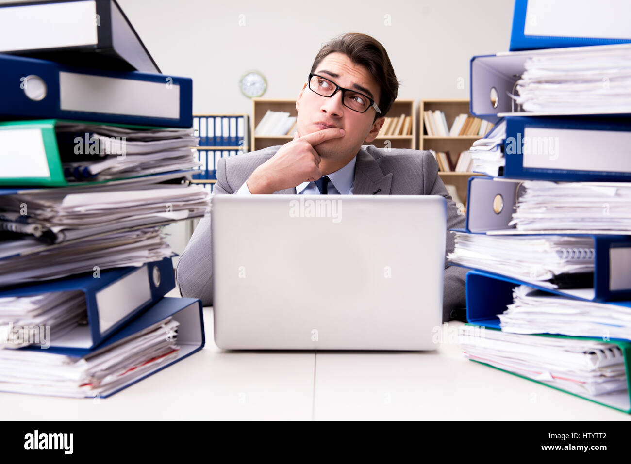 Busy businessman under stress due to excessive work Stock Photo - Alamy