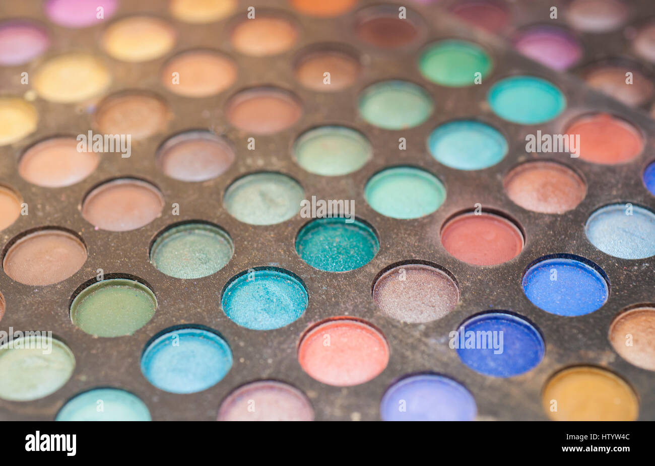 Closeup detail of multi colored color palette with eye shadow makeup ...