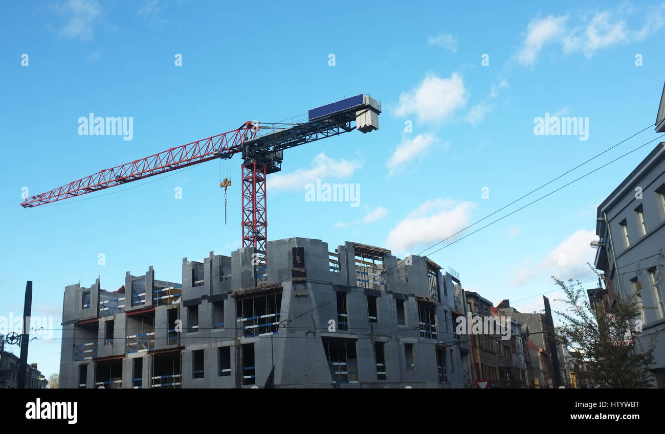 Construction of a modern building with crane Stock Photo - Alamy