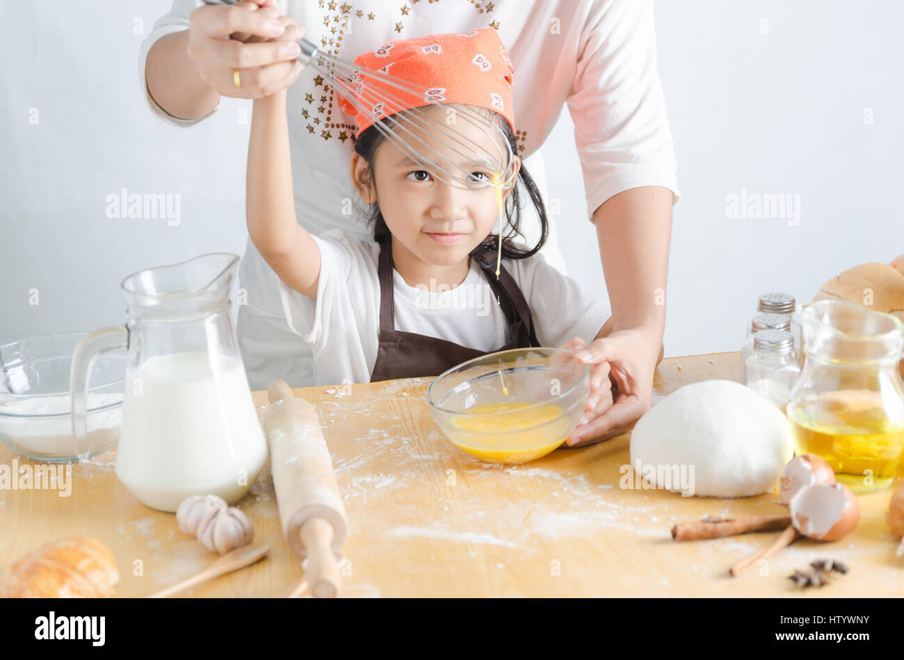 Close up shot of Asian little girl making bakery with mom with ...
