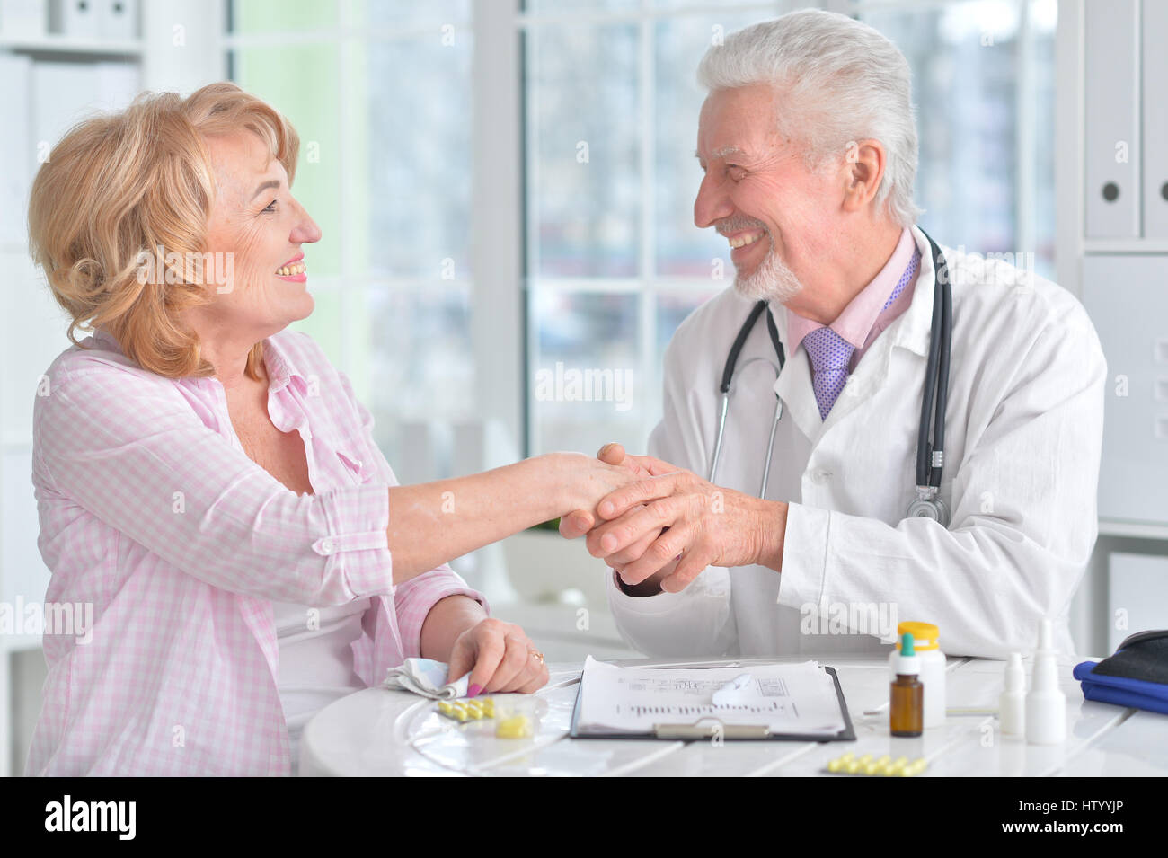 Sick elderly woman in a doctor's office Stock Photo - Alamy
