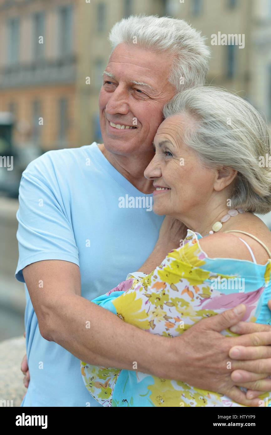 Happy elderly couple embracing Stock Photo - Alamy