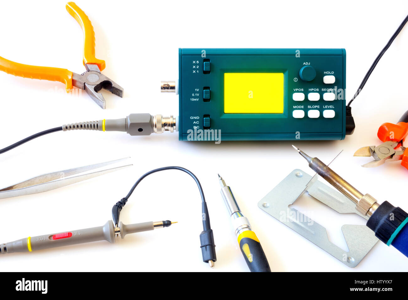 Modern digital signal oscilloscope and tools isolated on white ...