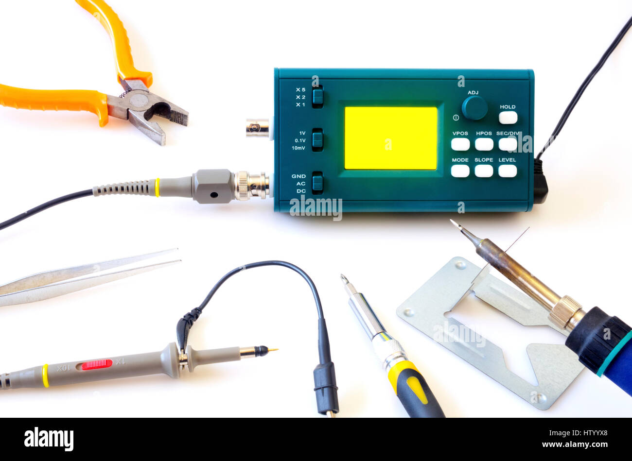 Modern digital signal oscilloscope and tools isolated on white ...