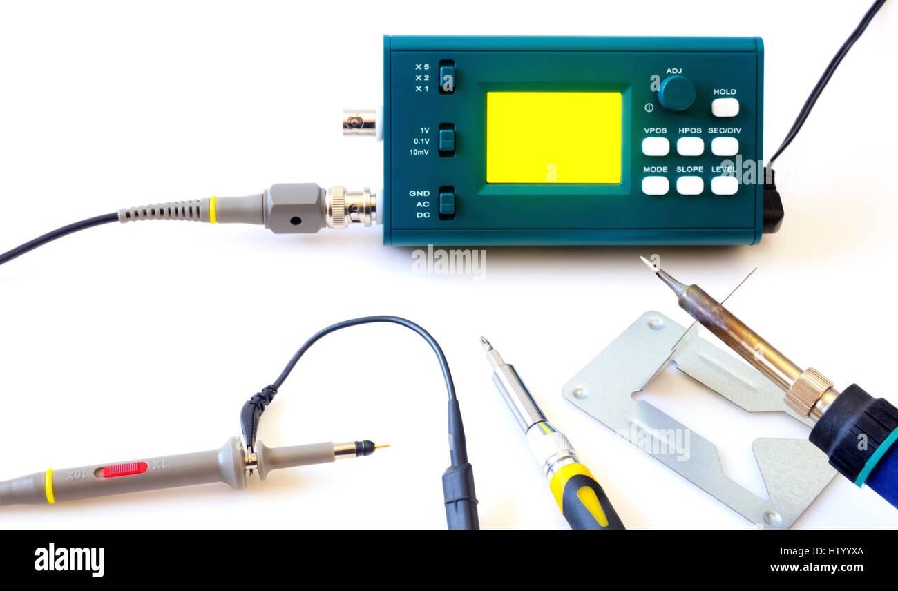 Modern digital signal oscilloscope and tools isolated on white ...