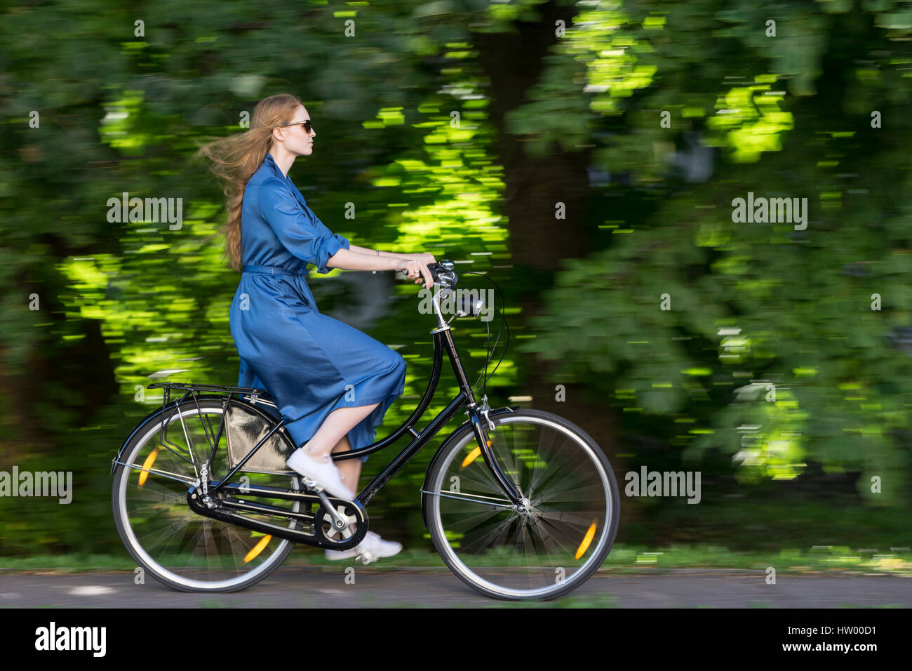 Beautiful young woman and vintage bicycle, summer. Red hair girl riding ...