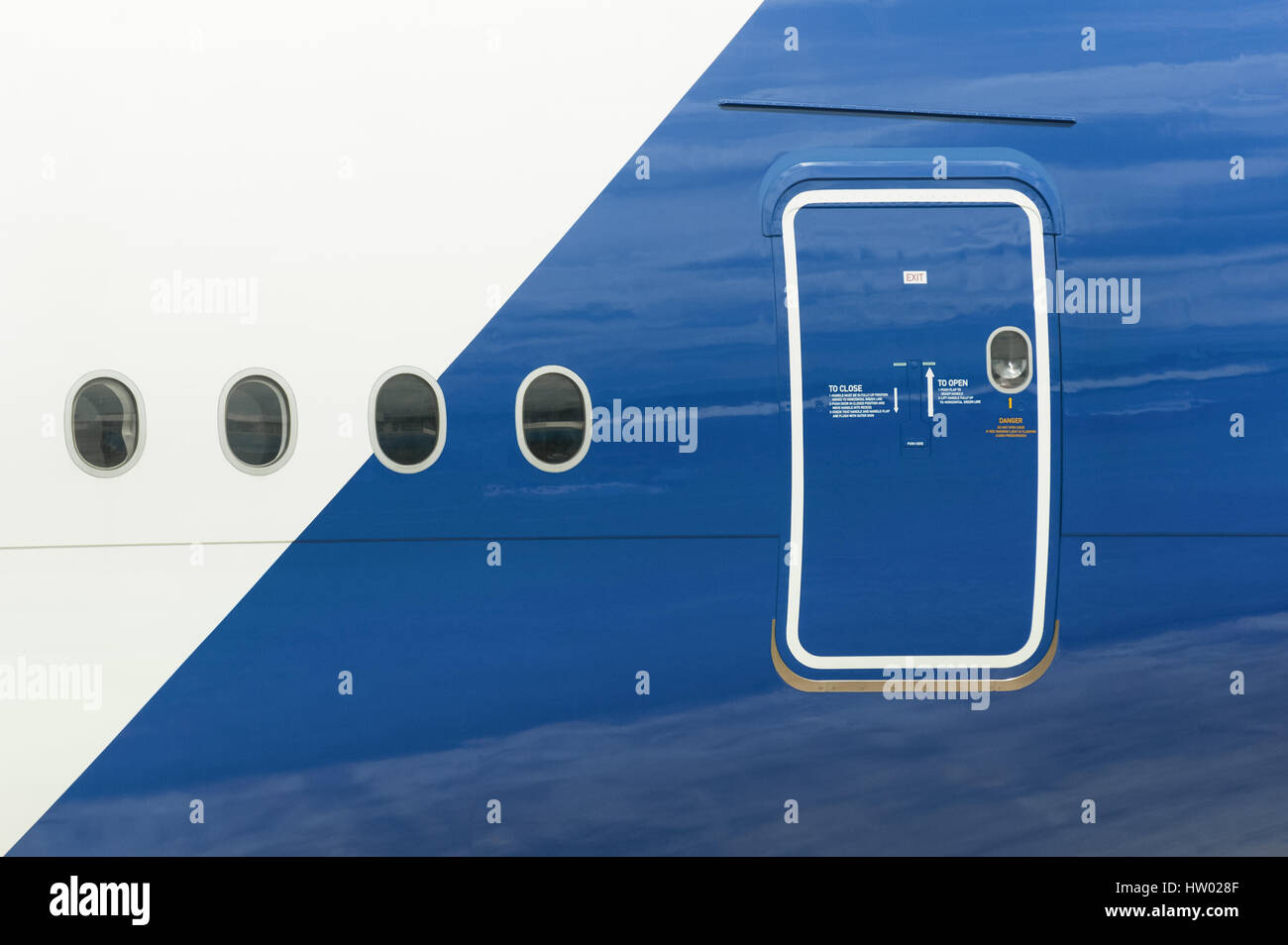emergency exit and windows on the fuselage of a passenger aircraft ...