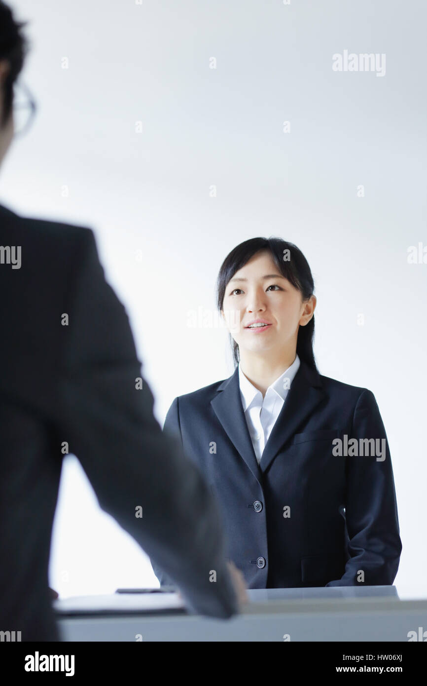 Japanese young woman undergoing job interview Stock Photo - Alamy