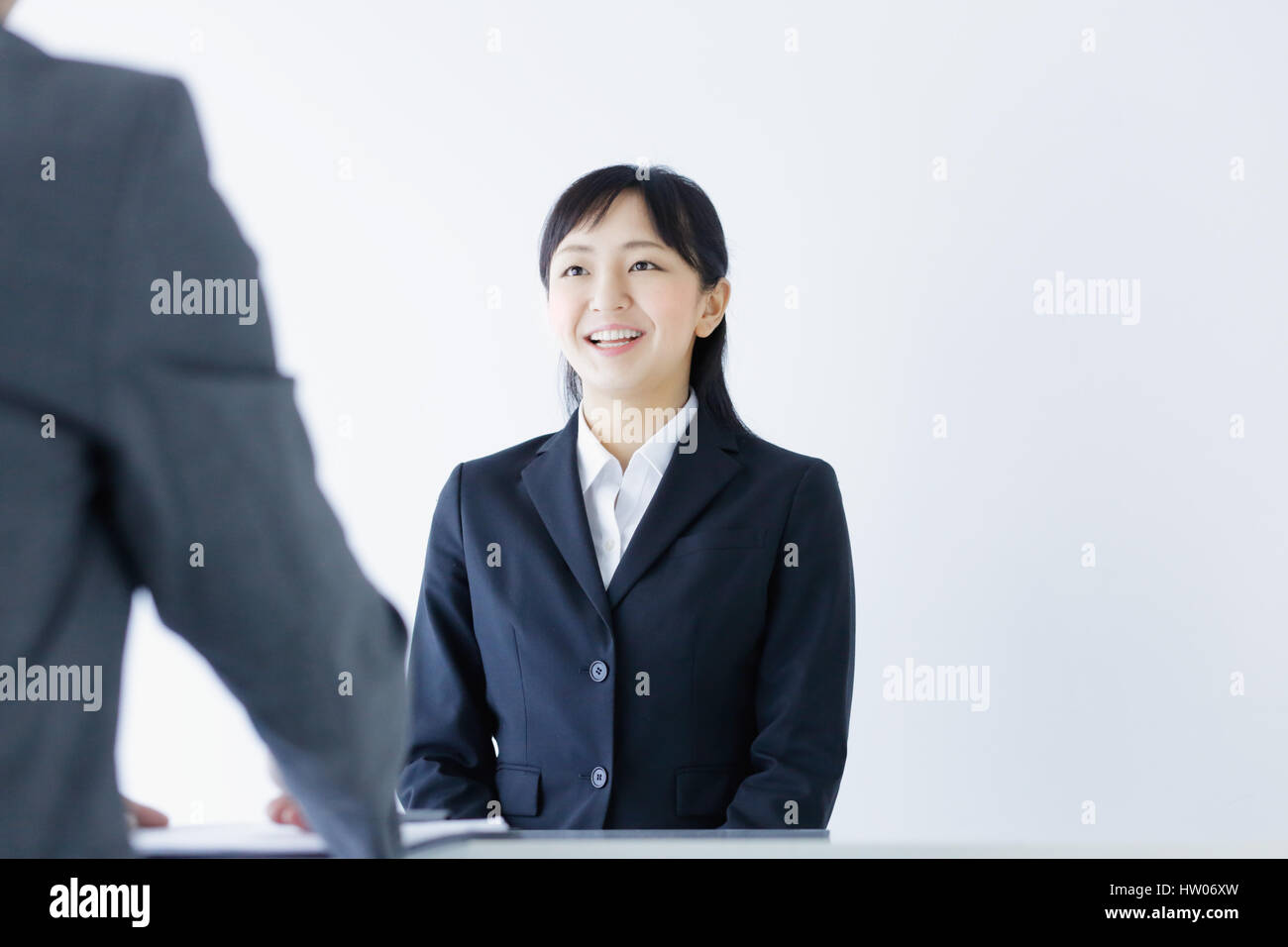 Japanese young woman undergoing job interview Stock Photo - Alamy