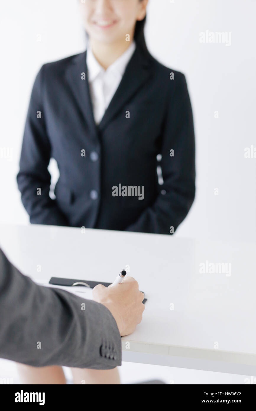 Japanese young woman undergoing job interview Stock Photo - Alamy