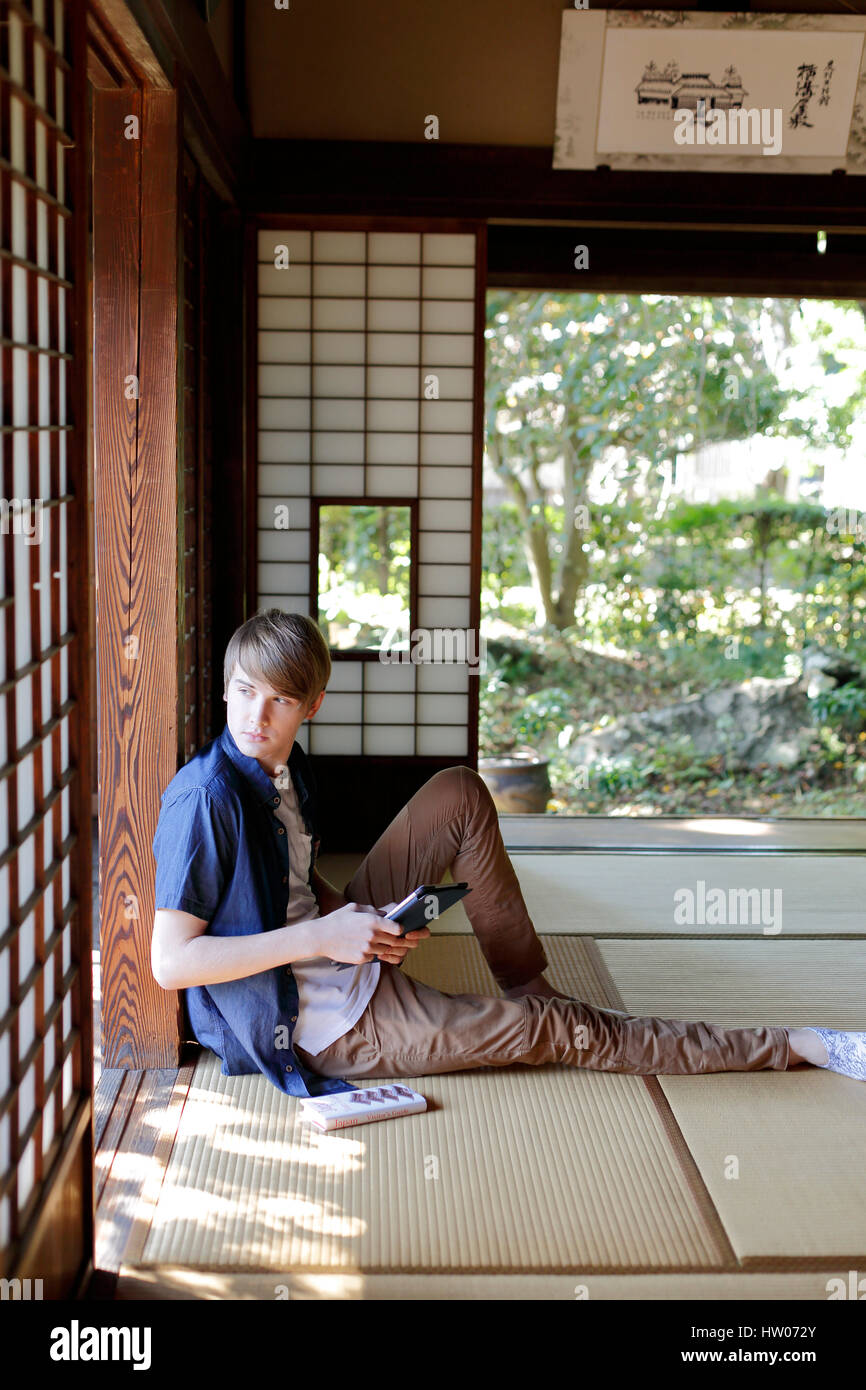 Caucasian man in traditional Japanese house Stock Photo - Alamy
