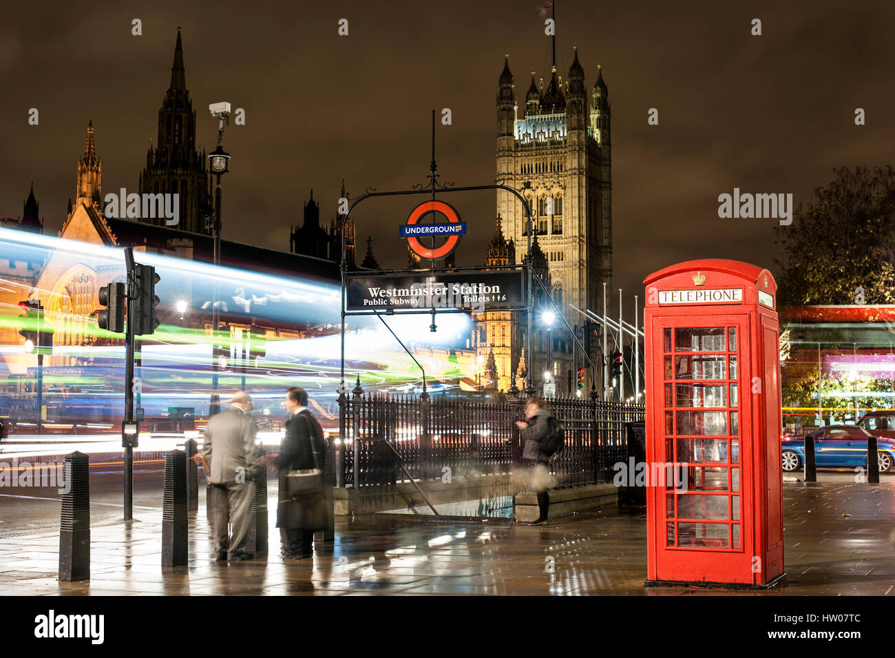 People walking and talking at night near the Westminster underground ...