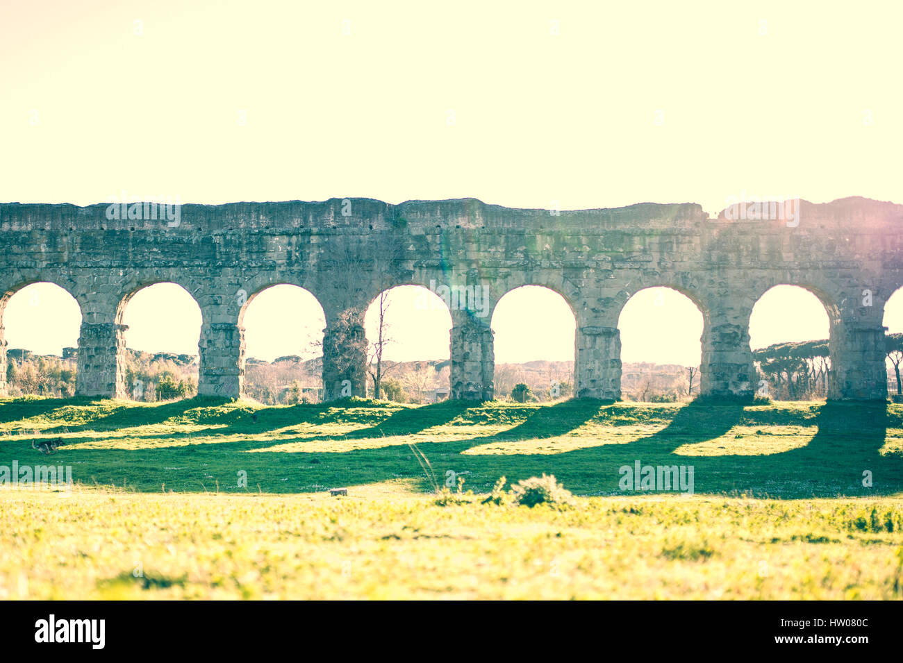 Roman aqueduct ancient ruins in Italy at sunset Stock Photo - Alamy