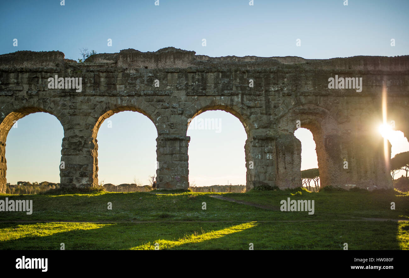 Roman aqueduct ancient ruins in Italy at sunset Stock Photo - Alamy