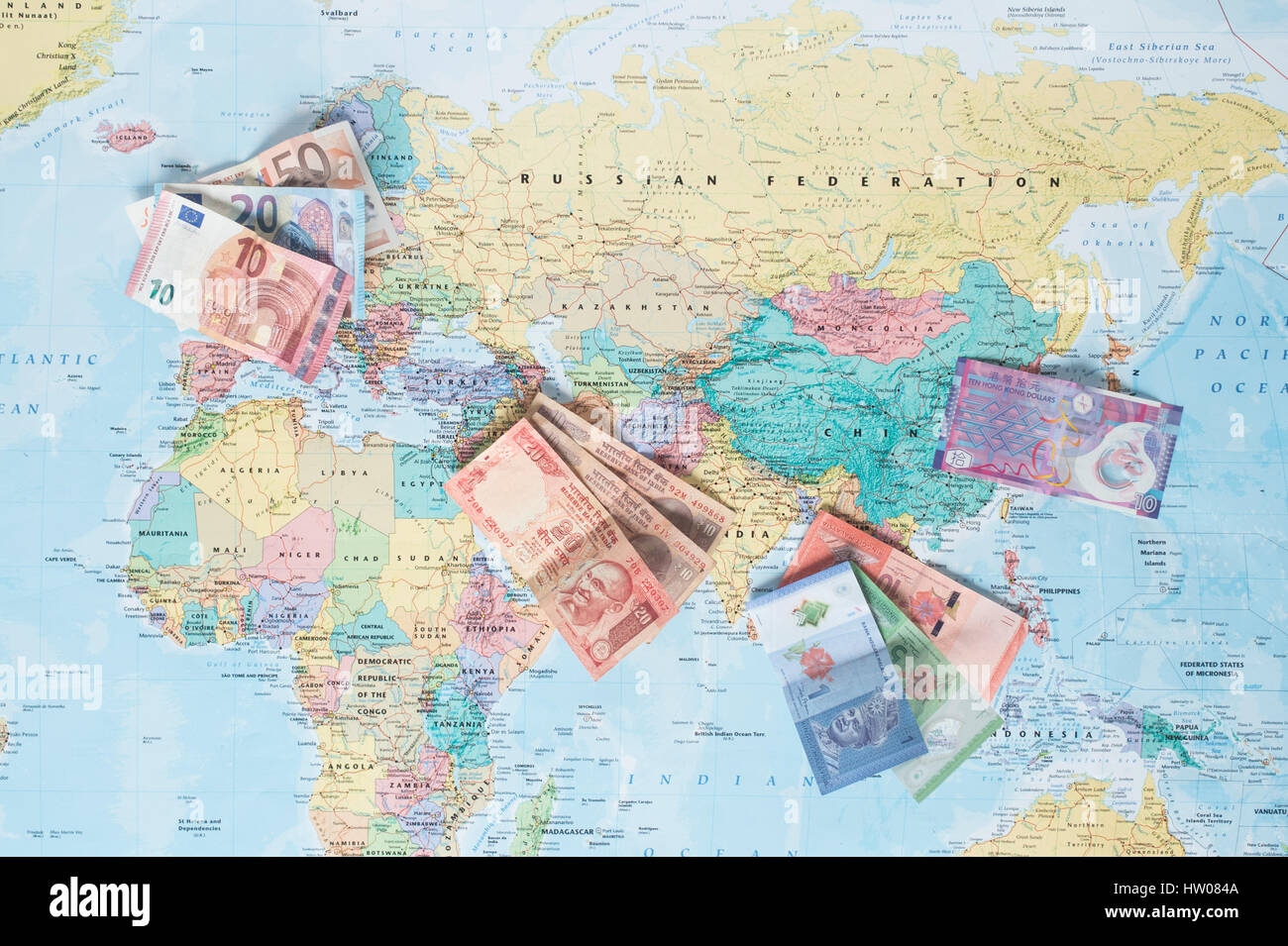 Money on a world map (Selective Focus Stock Photo - Alamy