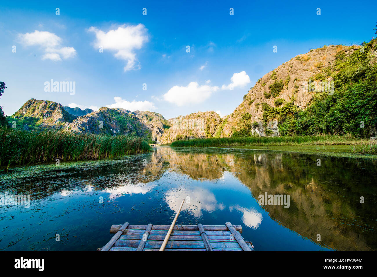 Traditional bamboo raft among the limestone mountains at Trang An, Tam ...