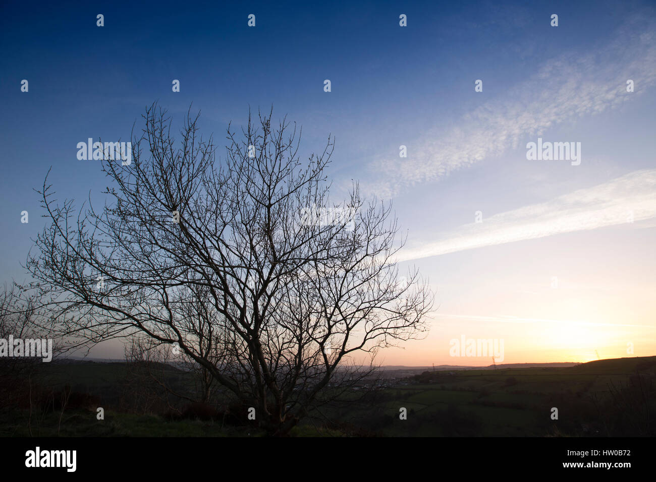 Halifax, UK. 15th Mar, 2017. UK Weather. The sun sets at the end of a ...
