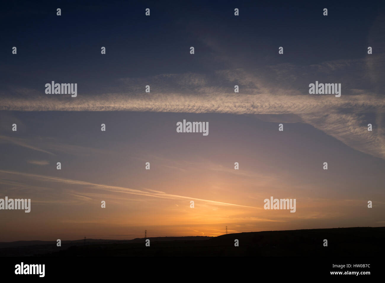 Halifax, UK. 15th Mar, 2017. UK Weather. The sun sets at the end of a ...
