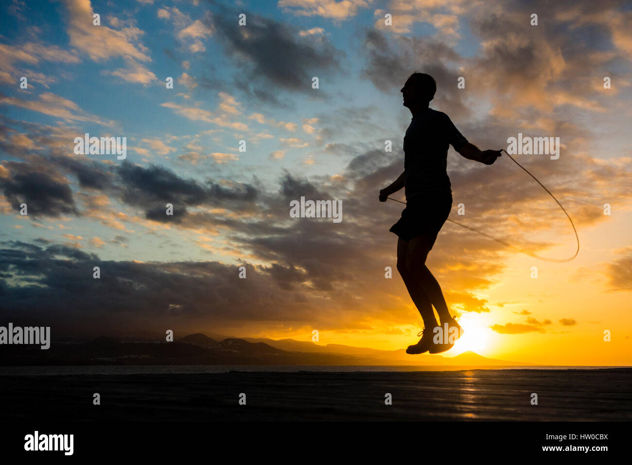 Man skipping silhouette hi-res stock photography and images - Alamy