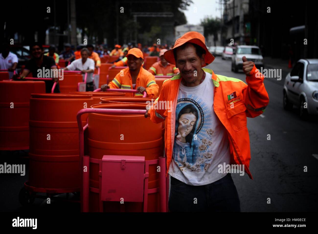 Mexico City, Mexico. 15th Mar, 2017. Sanitation workers walk in street ...