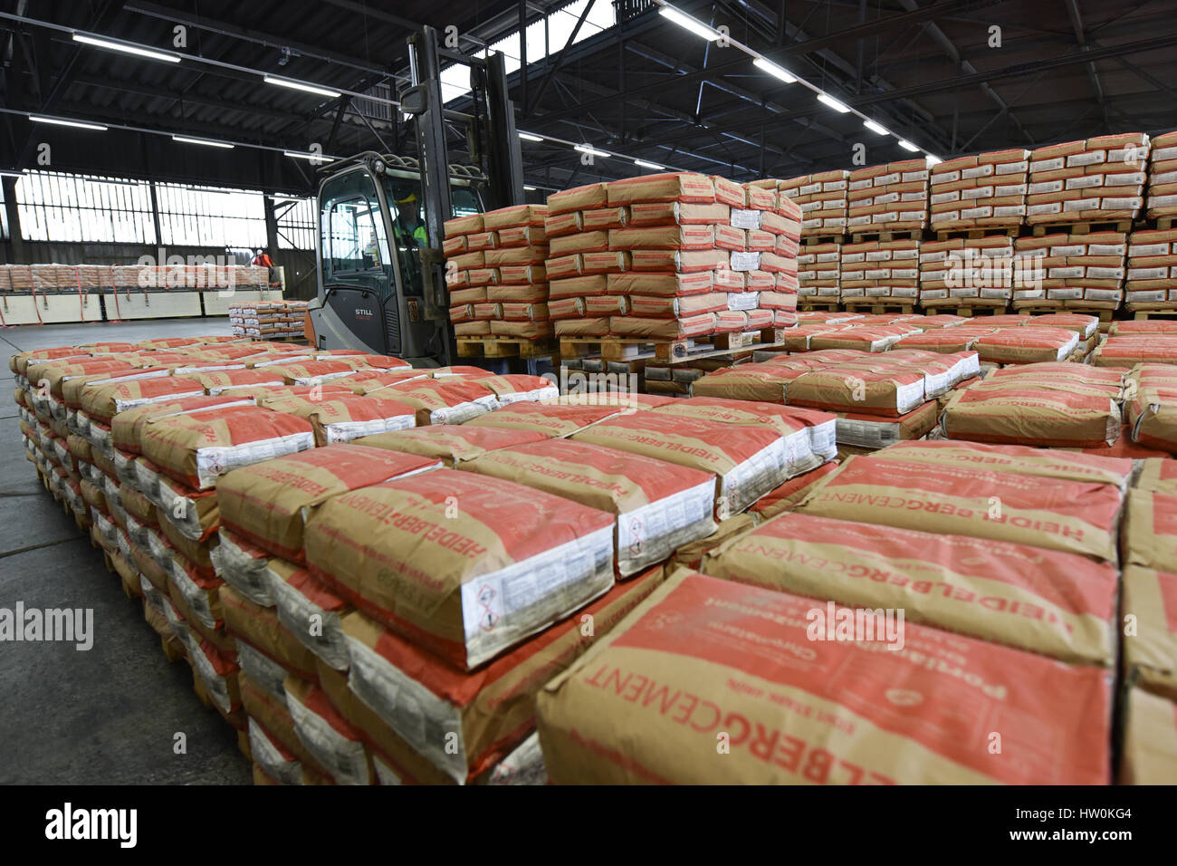 Leimen, Germany. 15th Mar, 2017. Bags of concrete are handled the ...