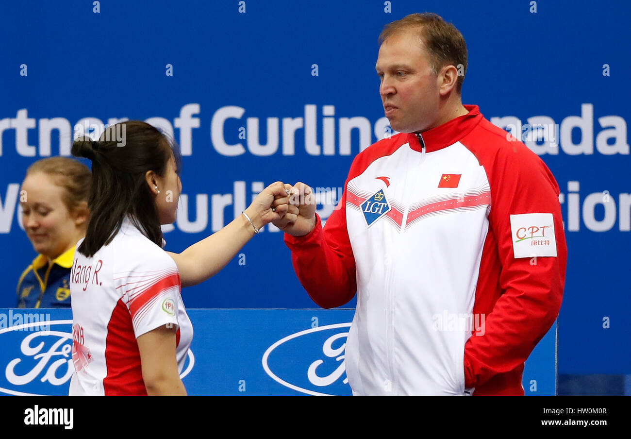 Beijing, China. 23rd Mar, 2017. Wang Rui of China greets her coach ...