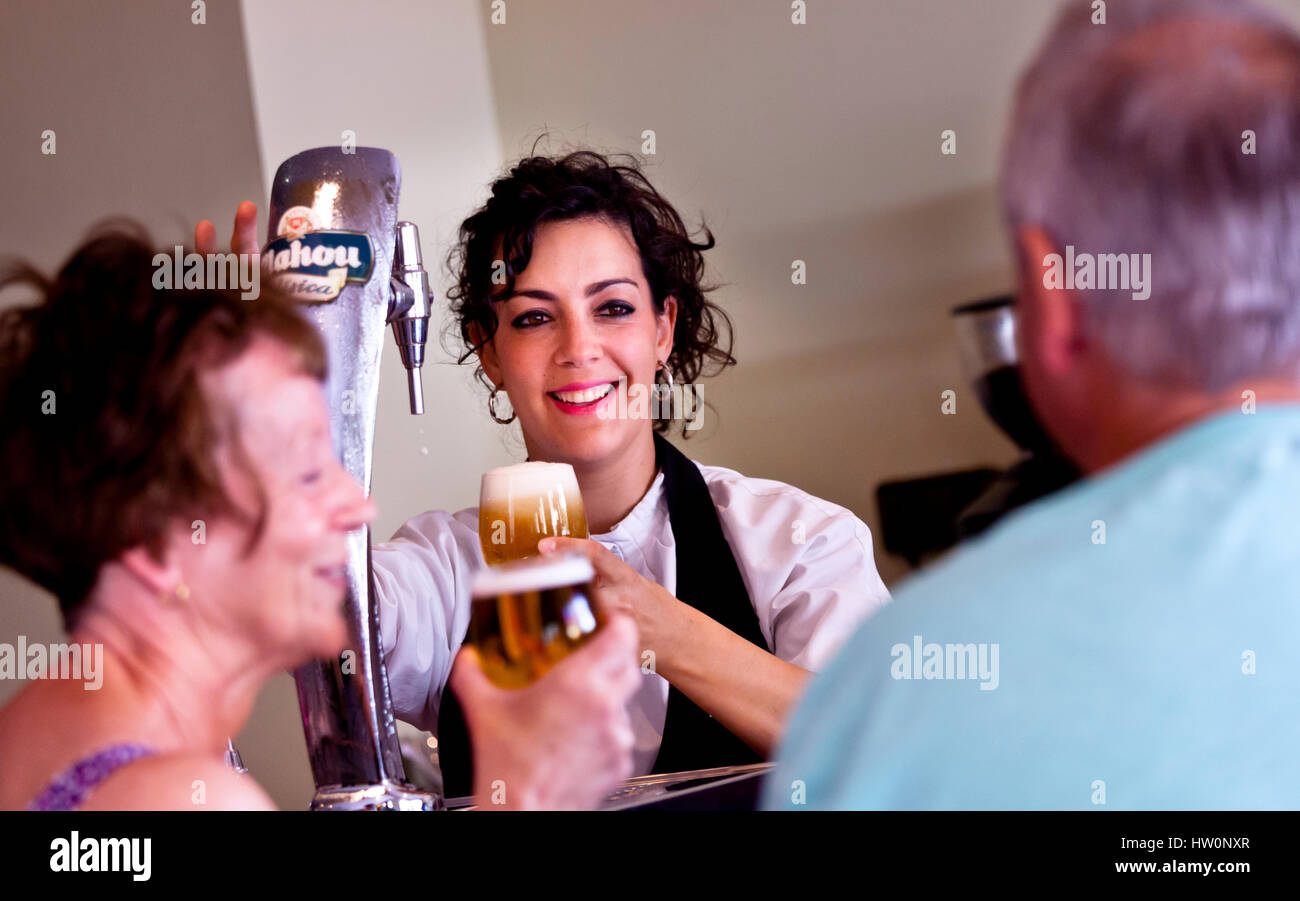 Bar woman pouring a beer Stock Photo - Alamy