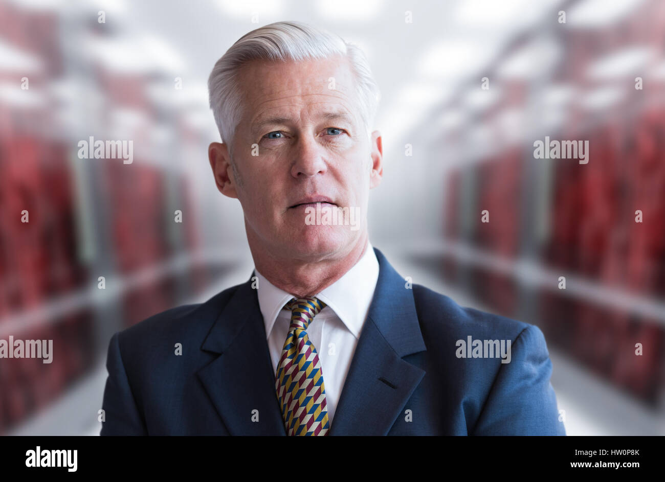 Portrait of senior businessman in big rack server room Stock Photo - Alamy