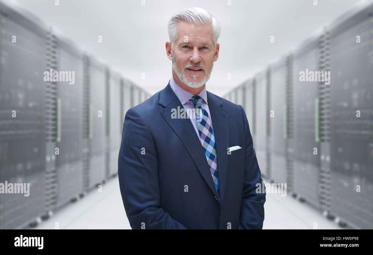 Portrait of senior businessman in big rack server room Stock Photo - Alamy