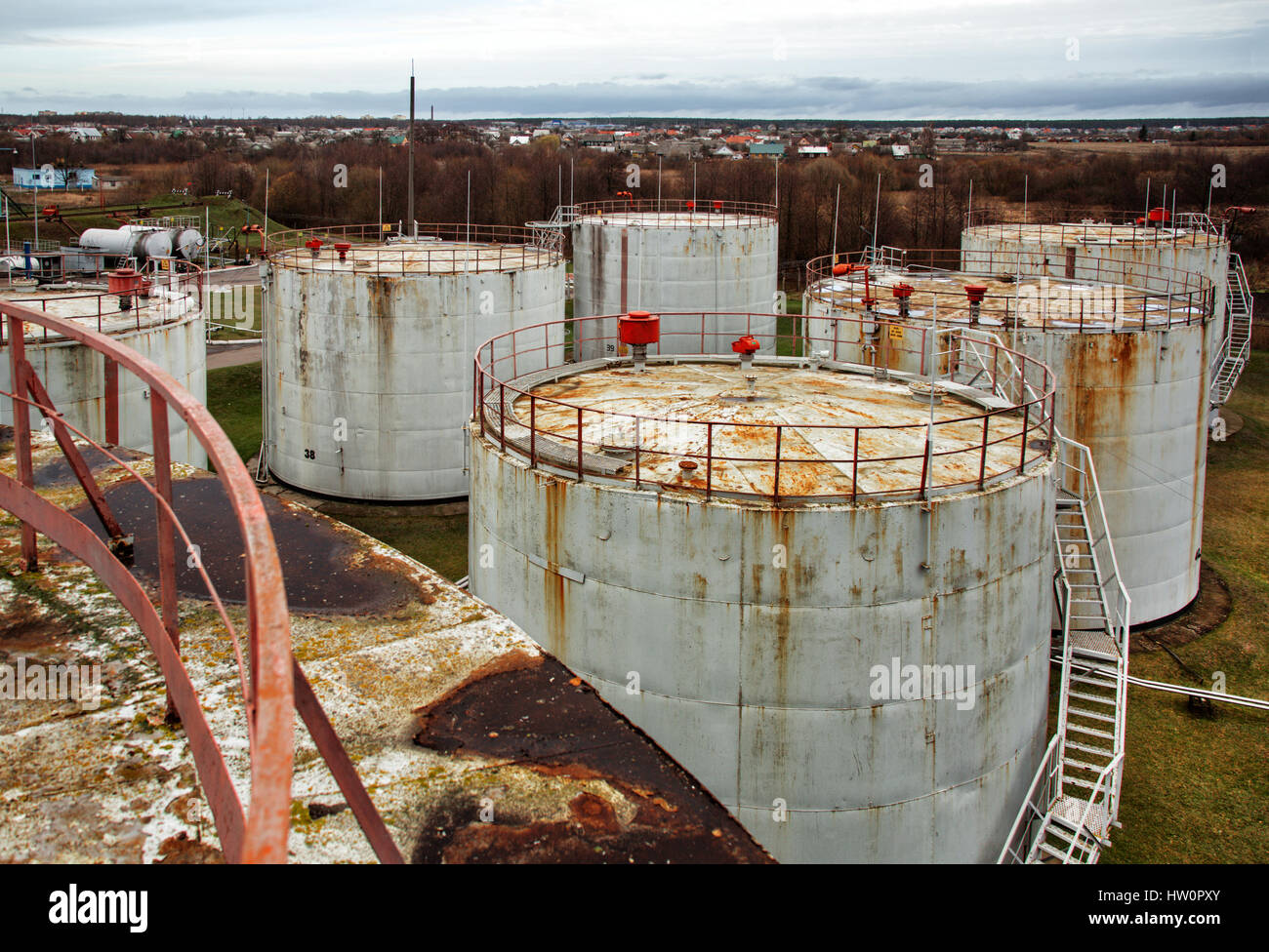 roofs of old oil storage tanks with equipment Stock Photo - Alamy