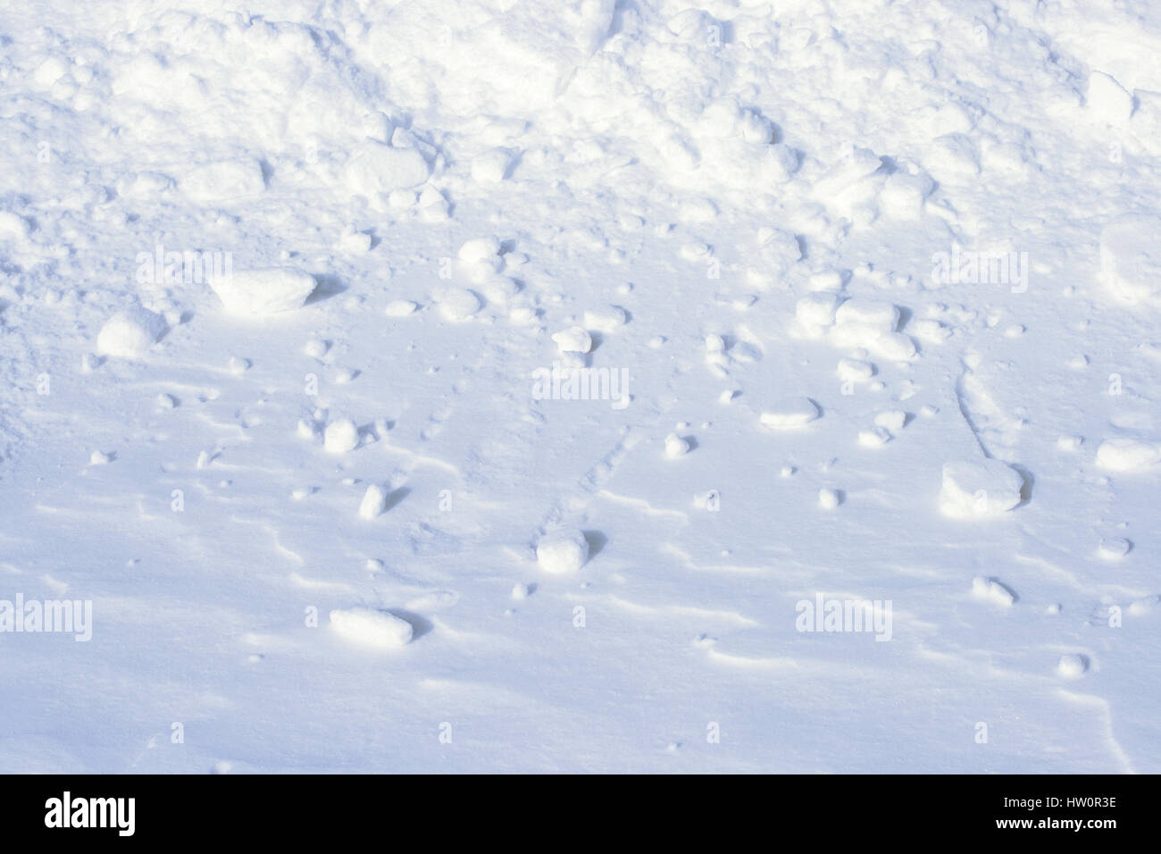 White snowy field with clumps of snow Stock Photo - Alamy