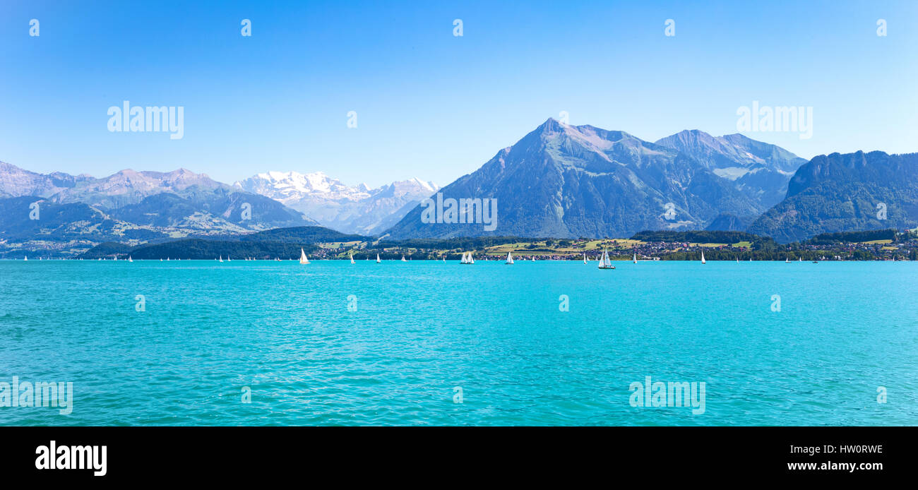 Switzerland , view of the Thun lake with the Swiss Alps in the ...