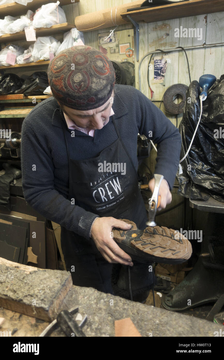 Expert European trained cobbler works in his shop in the Windsor ...